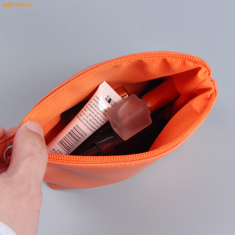 Compact Orange Cosmetic Bag – Vibrant and Portable Makeup Organizer